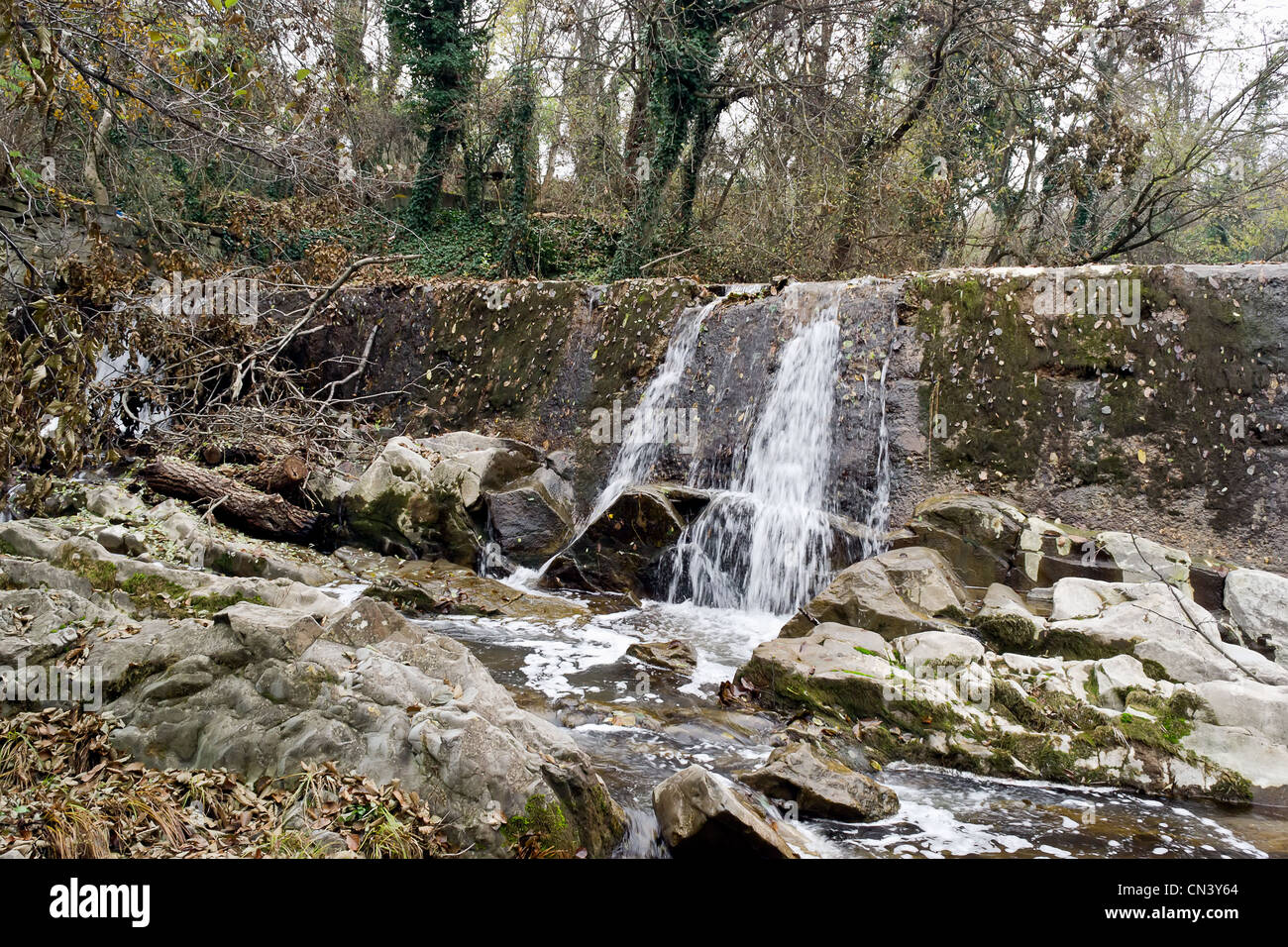 Artificial waterfall on the river Stock Photo - Alamy
