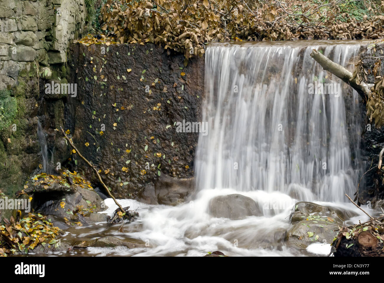 Artificial waterfall on the river Stock Photo - Alamy