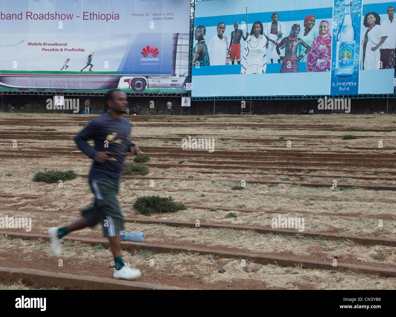 People running and training for marathon in Meskal Square, Addis Ababa ...