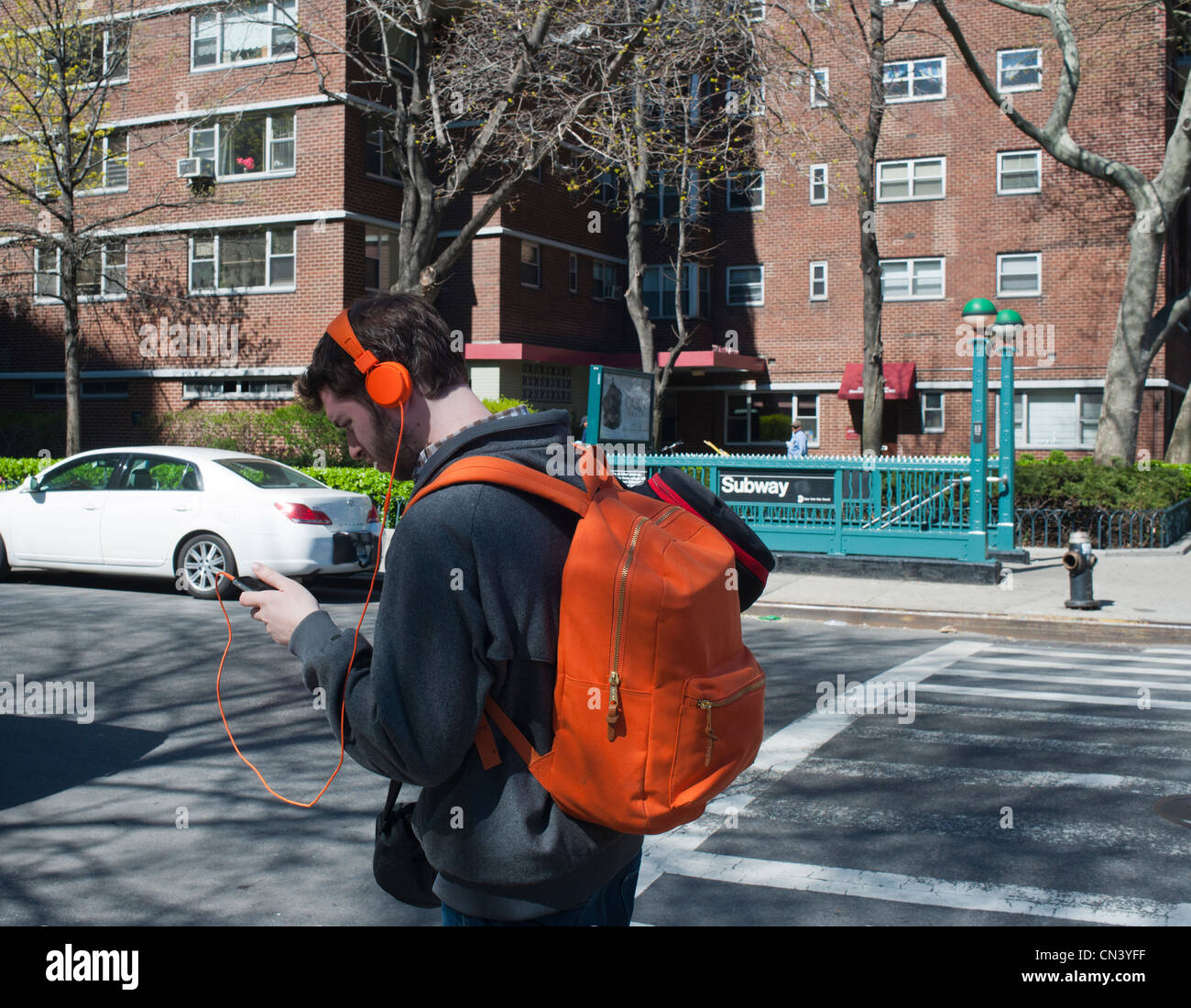 A music listener wears his over the ear headphones in the Chelsea ...