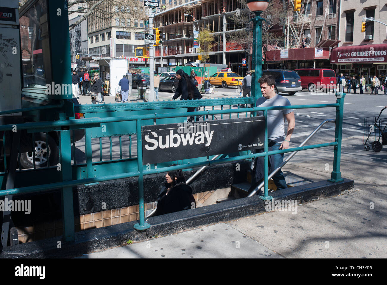 Passengers enter a subway station at West 23rd Street and Eighth Avenue ...
