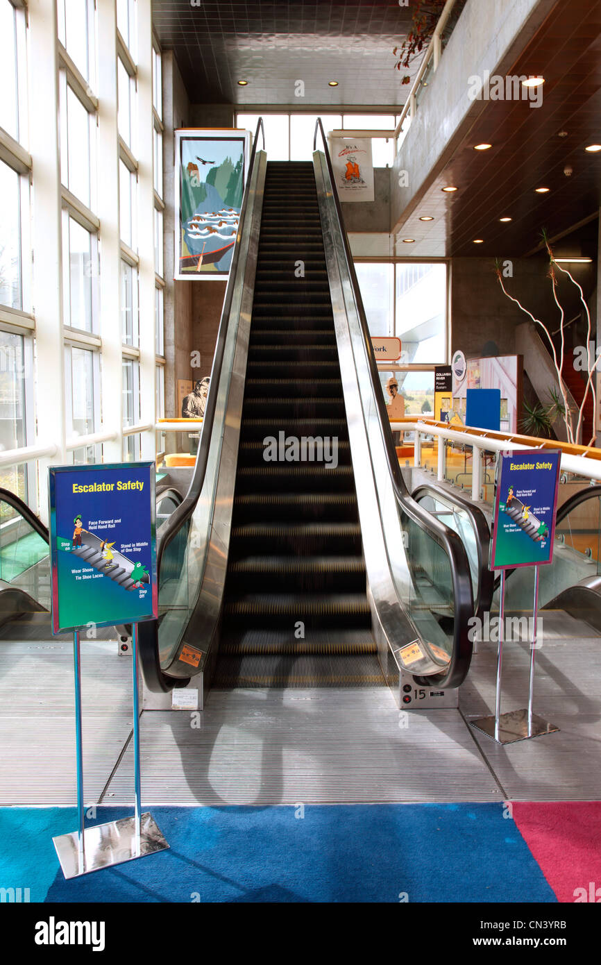 Escalator & signs Stock Photo - Alamy