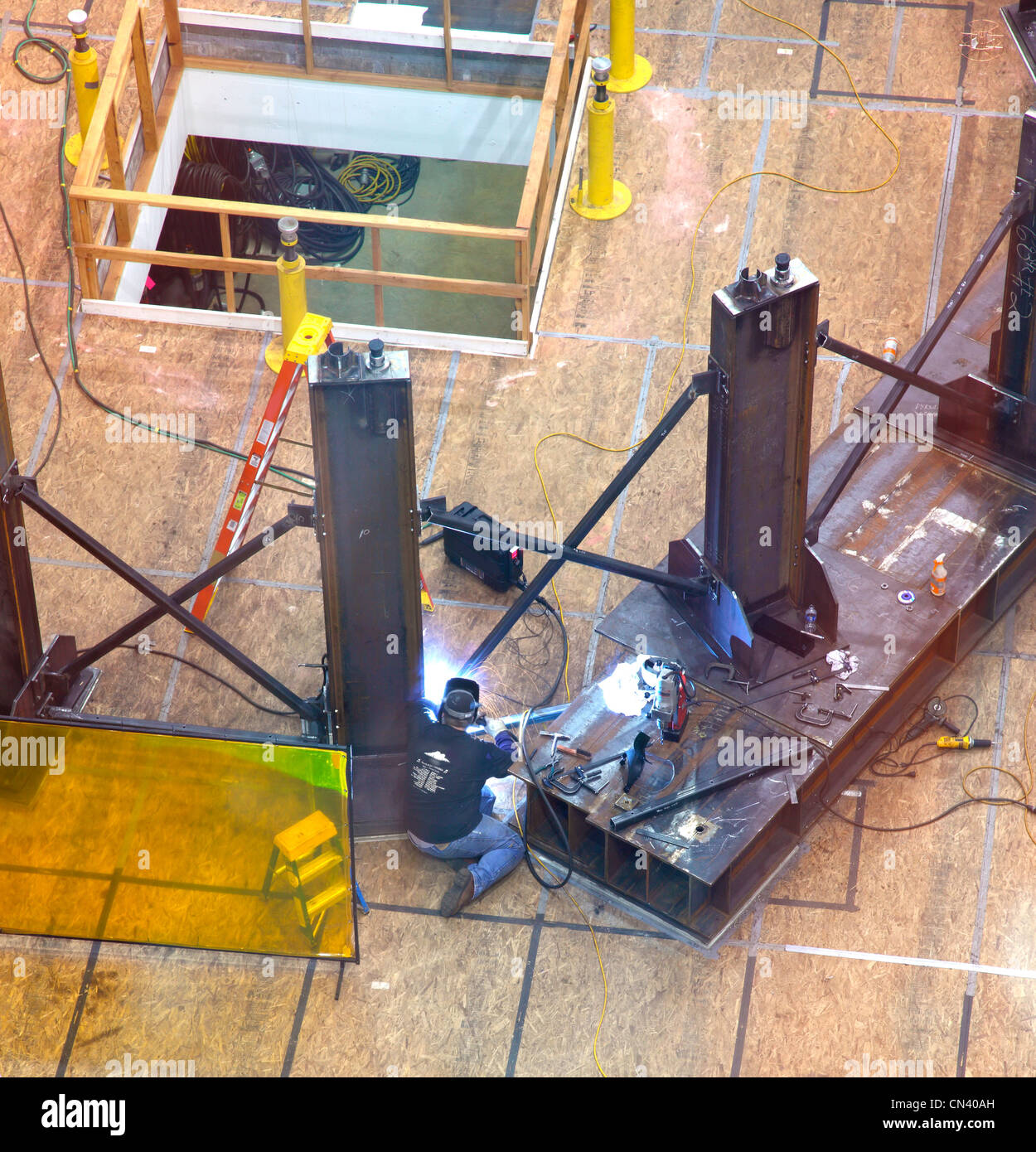 A welder joining metals for an indoor structure, Bonneville Oregon ...