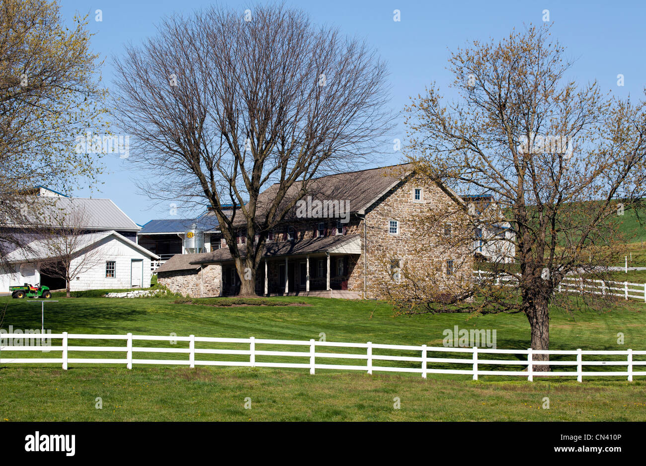 Stone Mennonite farmhouse with a sweeping white fence. Shot in early ...