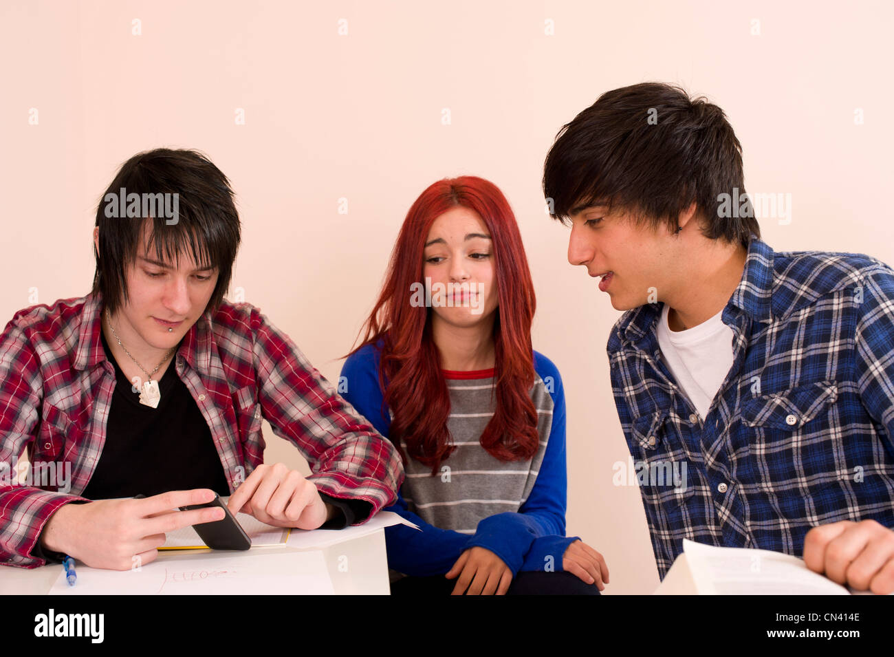 She is not very pleased at what is being shown on the smartphone Stock ...