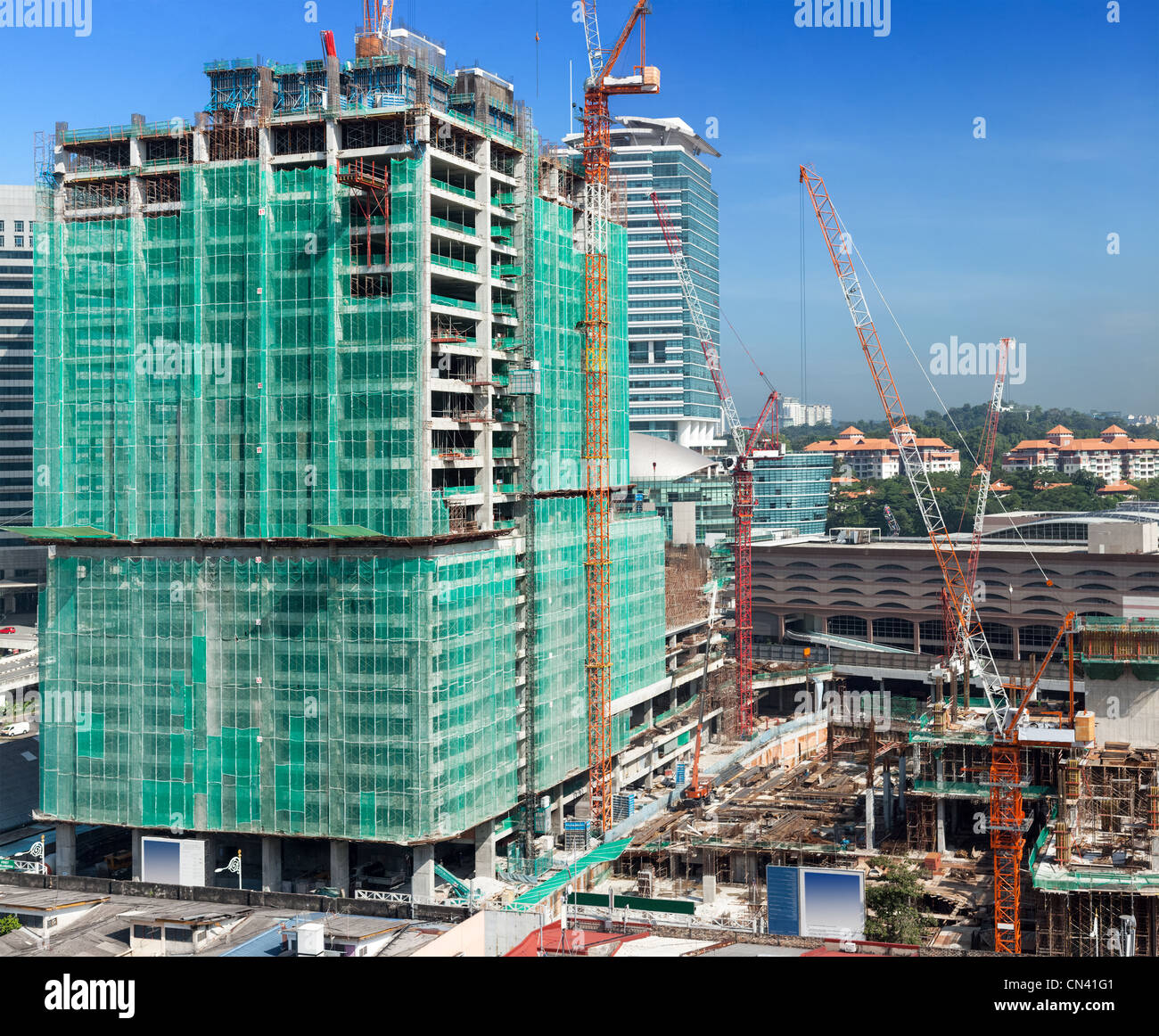 Building house construction site with cranes. Square format Stock Photo ...