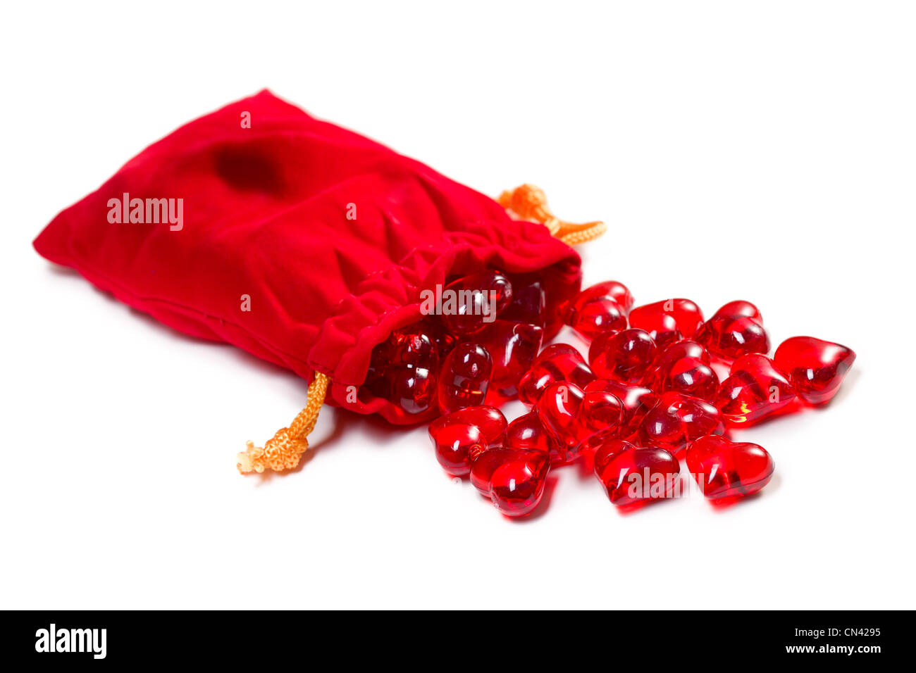 red hearts in red sack on white background Stock Photo - Alamy