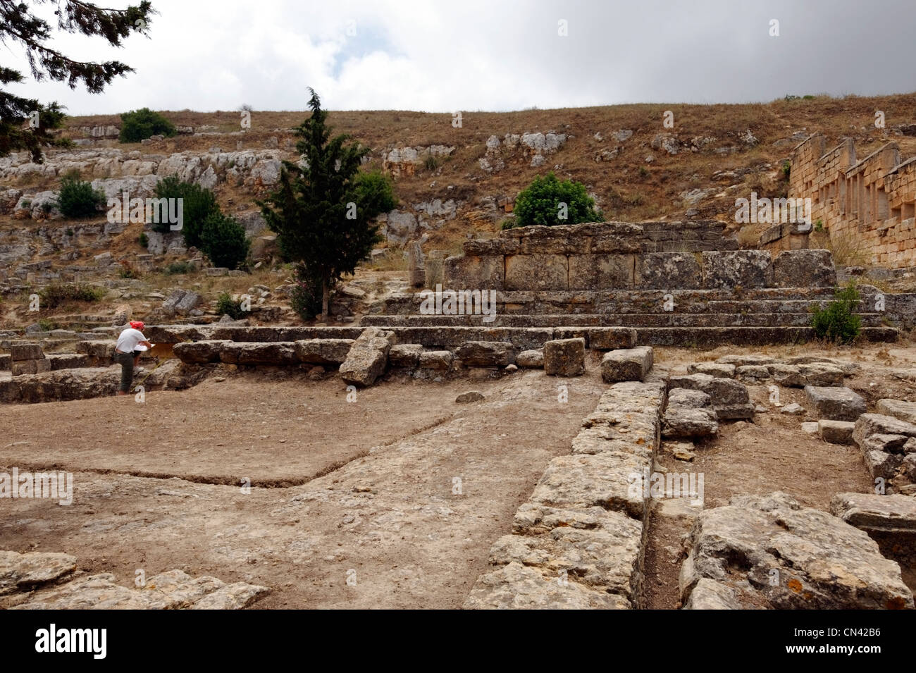 Cyrene. Libya. An archaeologist surveying an unidentified temple with ...