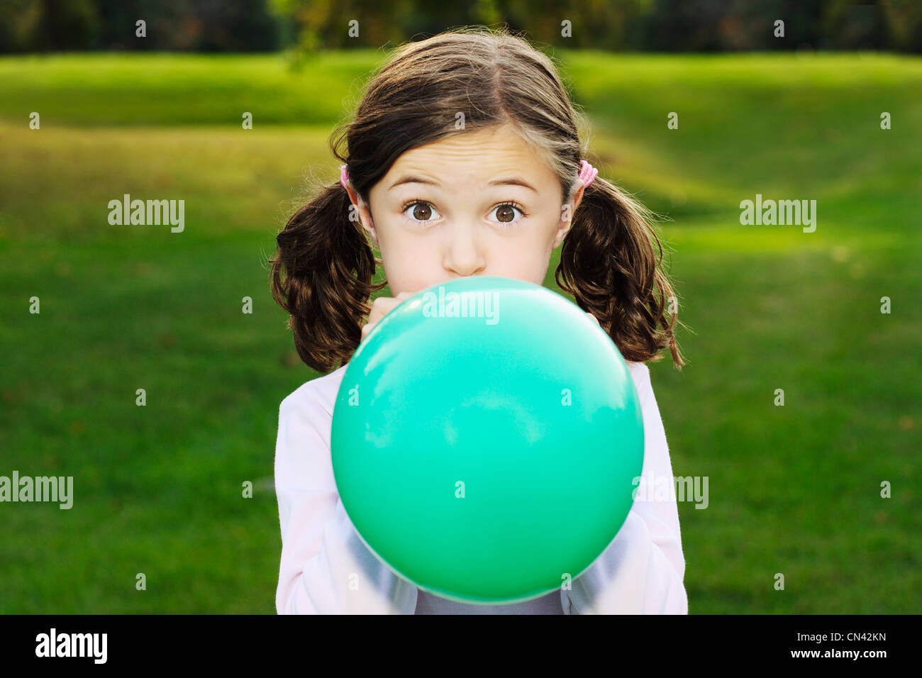 Young Girl Inflating a Balloon, Toronto, Ontario Stock Photo - Alamy