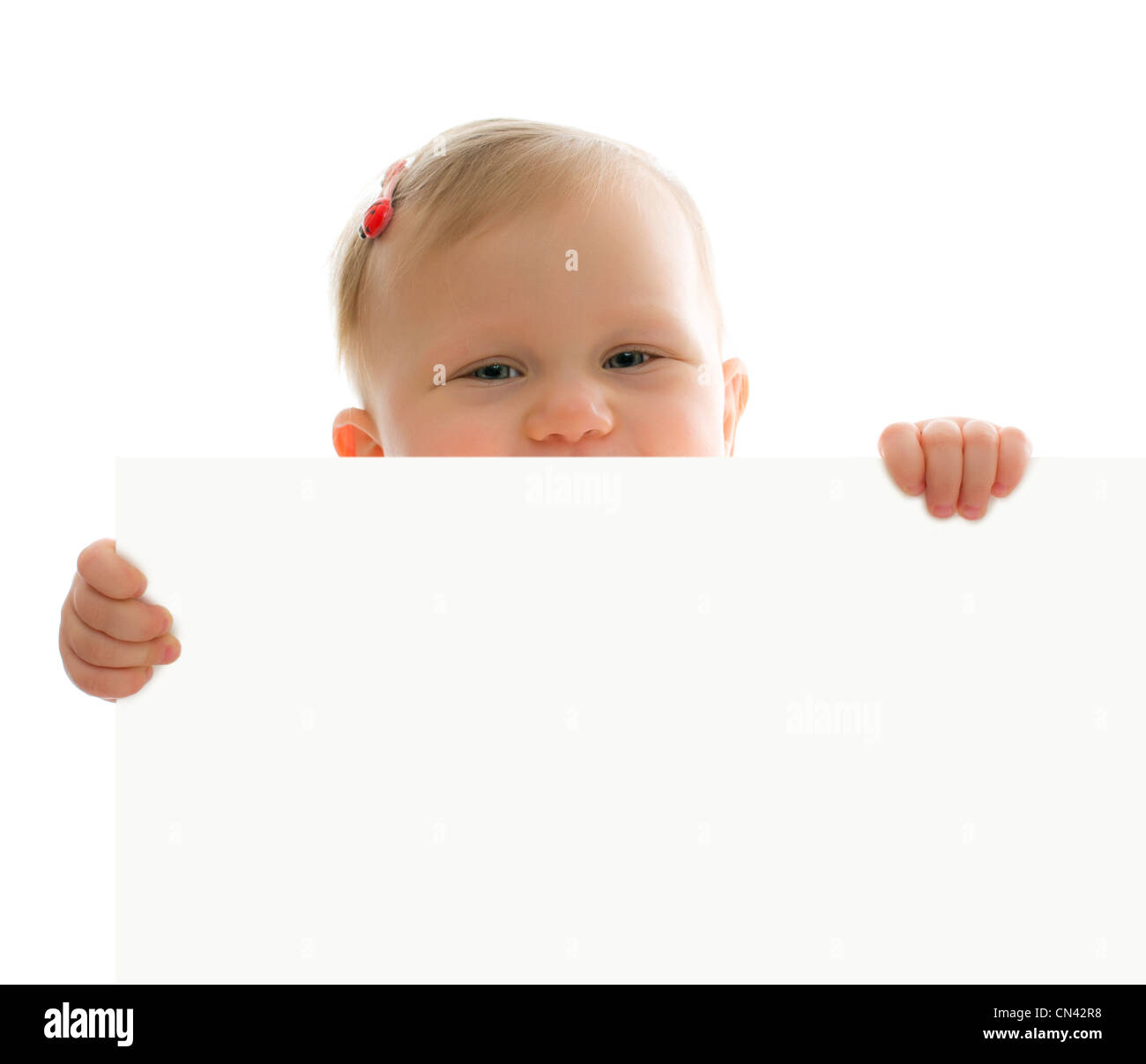 studio shot of little baby behind white board Stock Photo - Alamy