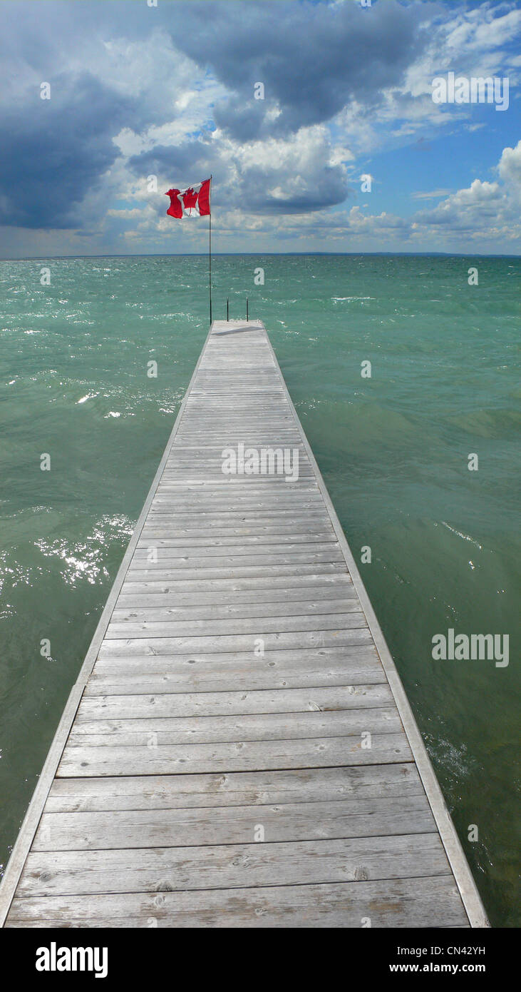 Dock and Canadian Flag, Gamebridge Beach, Lake Simcoe, Ontario Stock ...