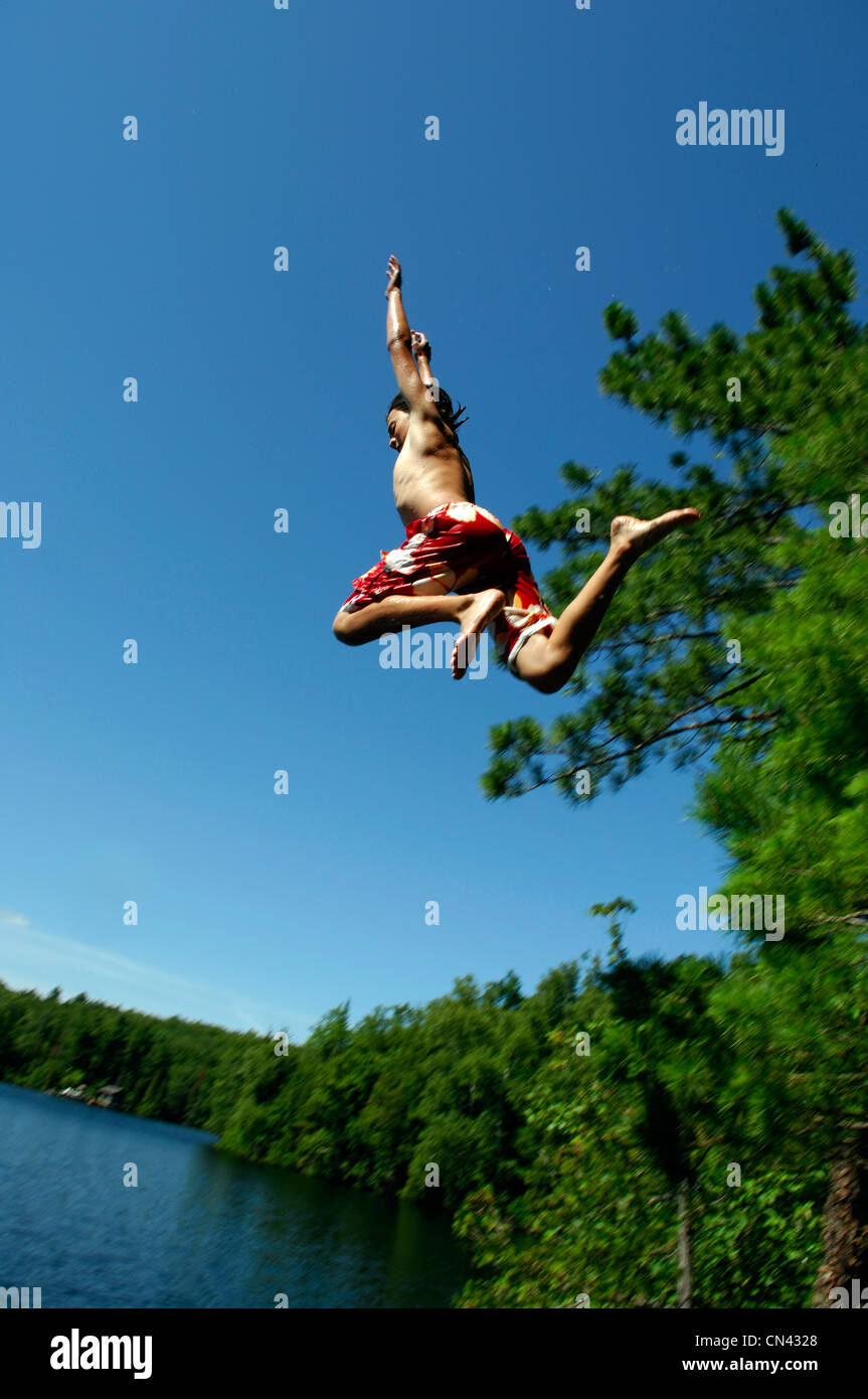 Boy jumping off cliff hi-res stock photography and images - Alamy