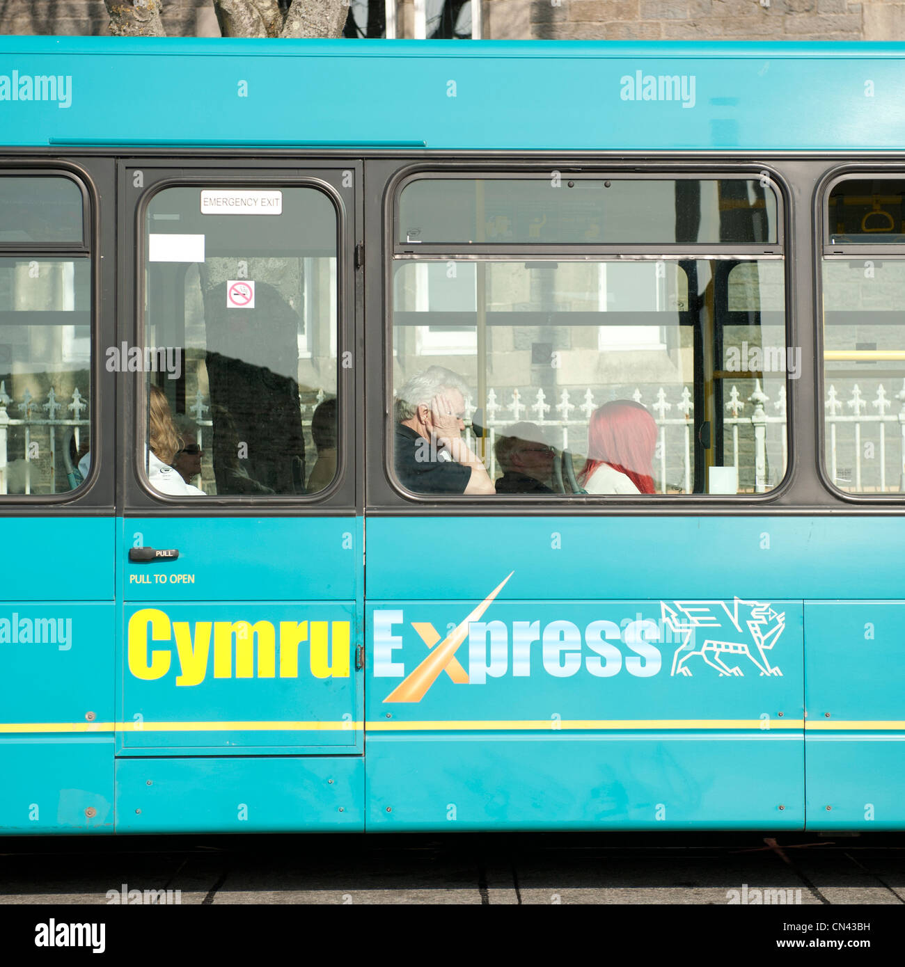 Passengers on board a Cymru Express public transport bus service ...
