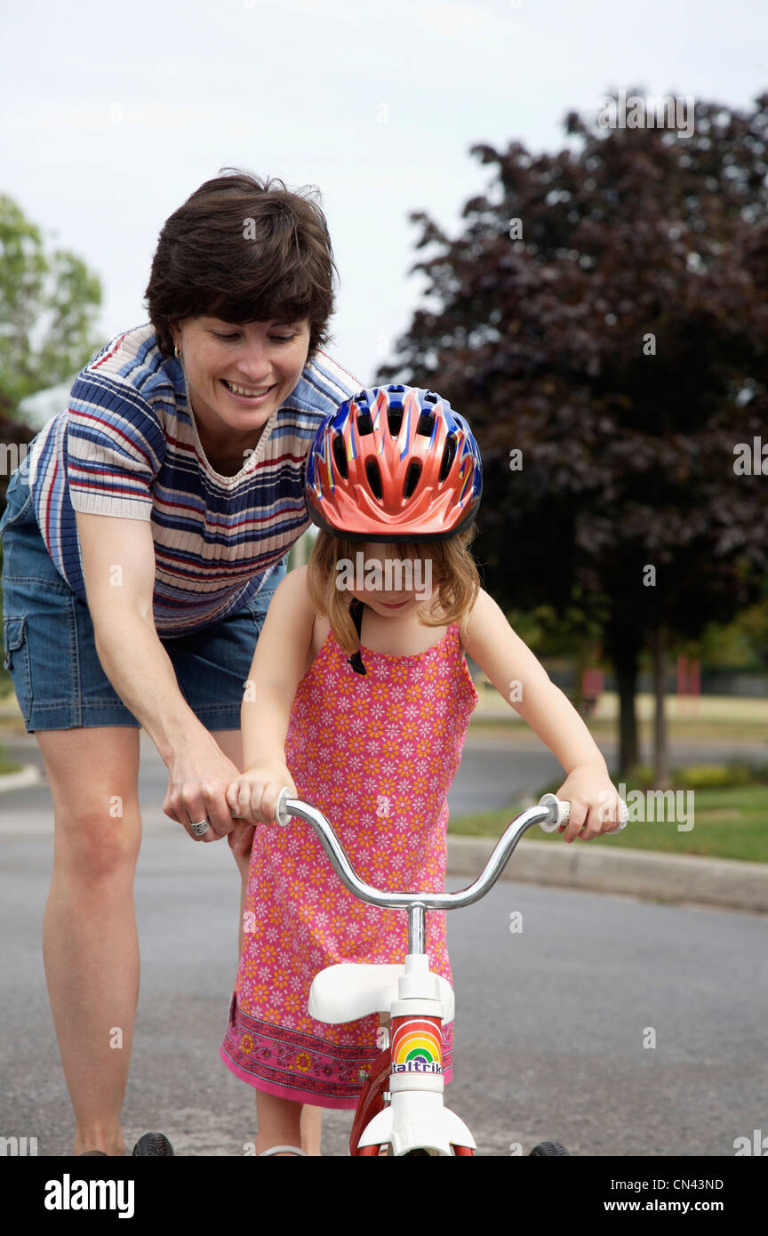 Child riding tricycle helmet hi-res stock photography and images - Alamy