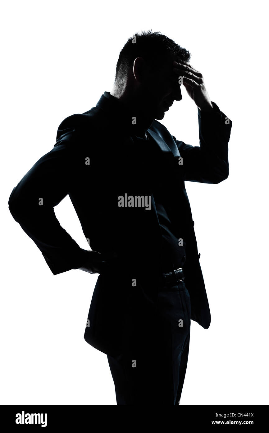 one caucasian man portrait silhouette tired migraine backache in studio ...