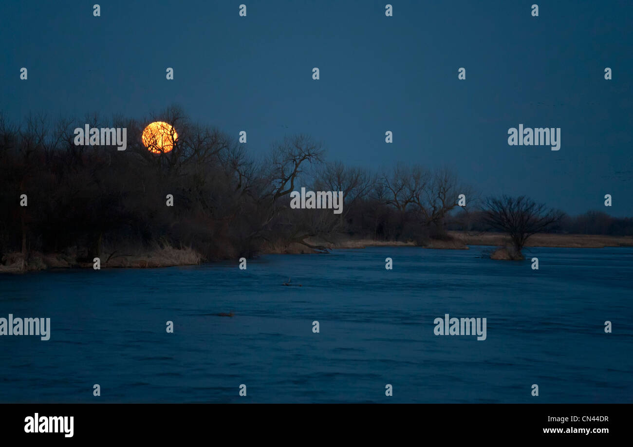 Kearney, Nebraska - A full moon sets over the Platte River Stock Photo ...