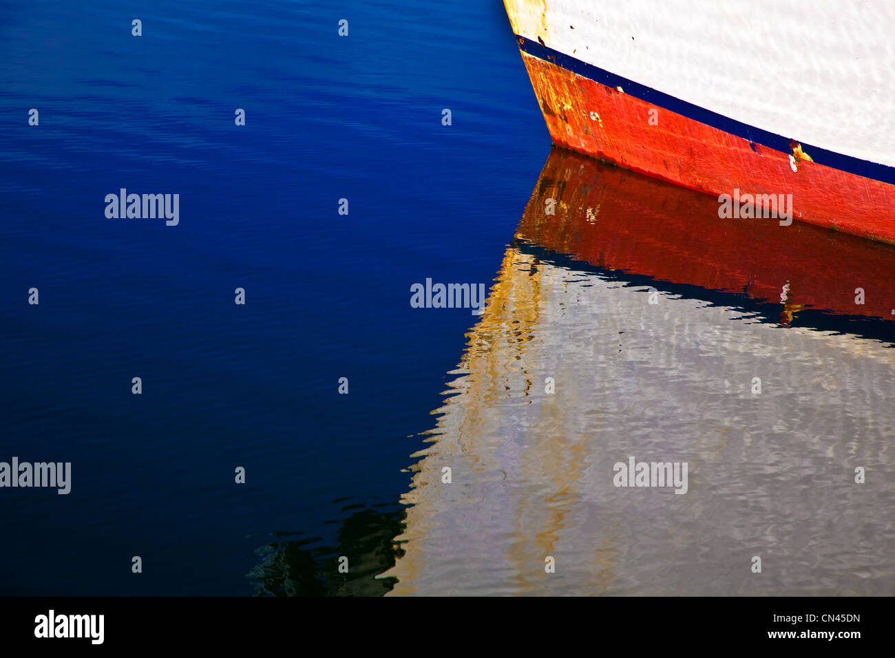 Reflection of boat bow in water Stock Photo - Alamy