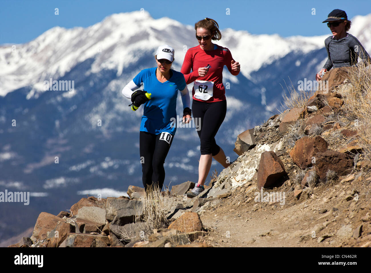 Three female runners compete in the Run Through Time Half Marathon ...