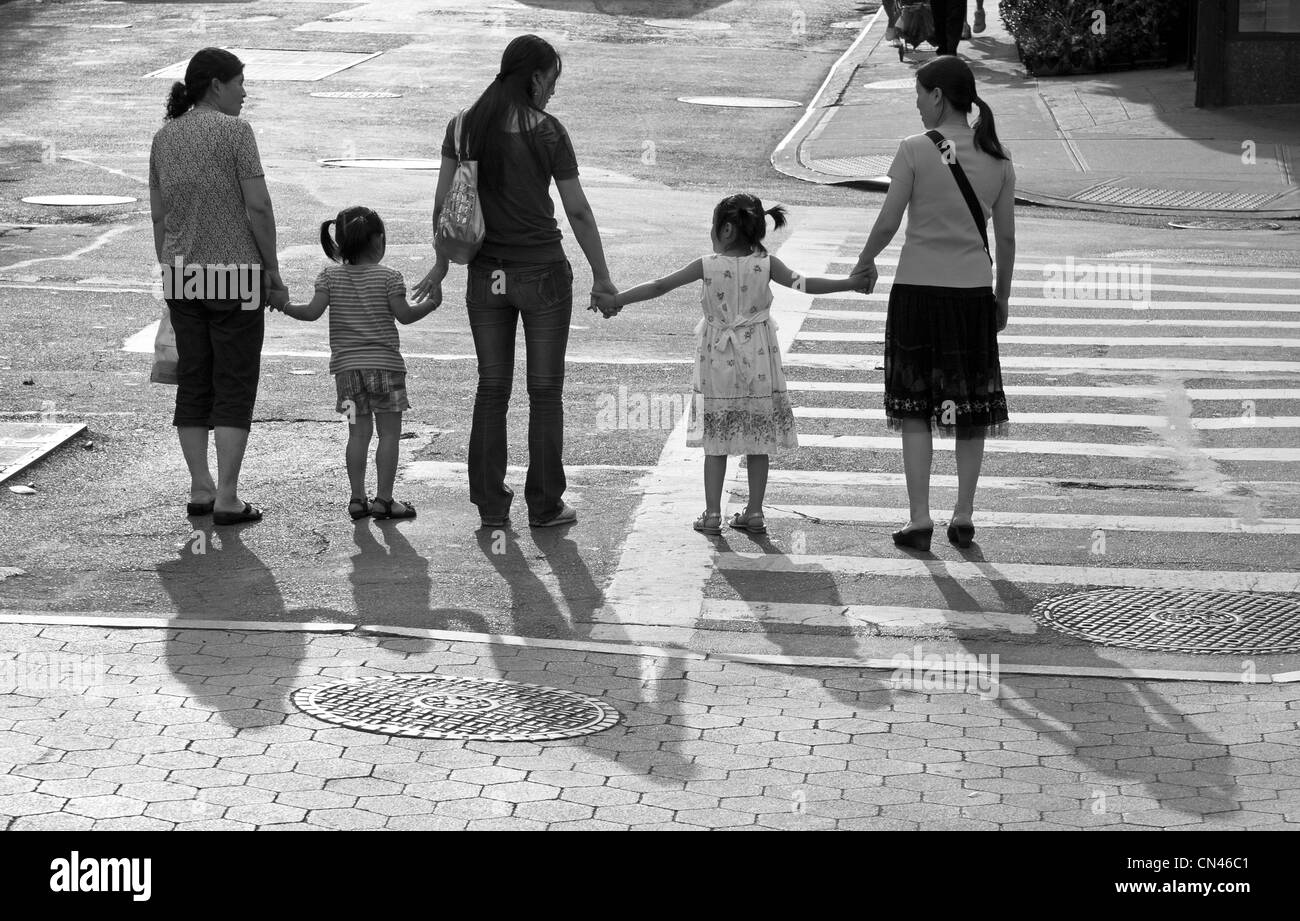 Adults children hold hands crossing hi-res stock photography and images ...