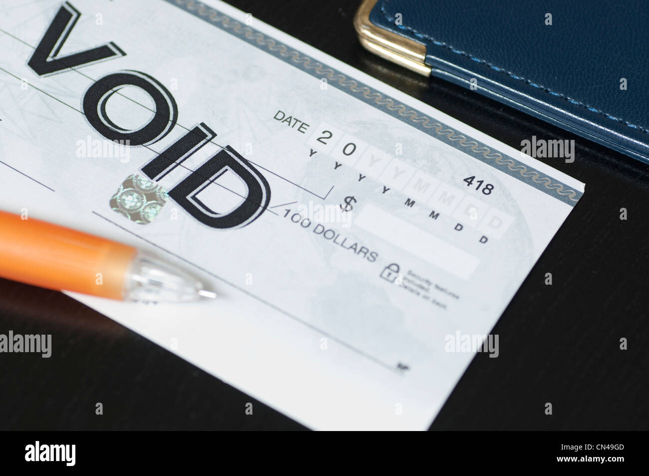Void check and pen Stock Photo - Alamy