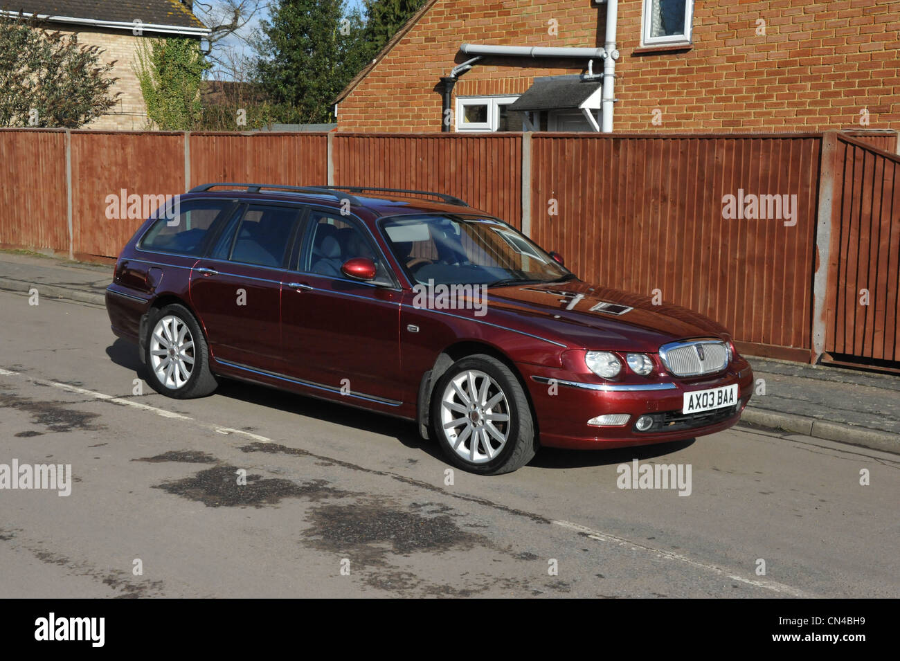 A Rover 75 Tourer being driven down a residential street in Surrey ...