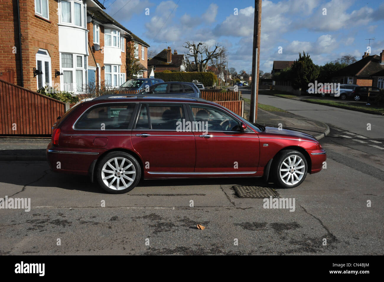 A Rover 75 Tourer being driven down a residential street in Surrey ...