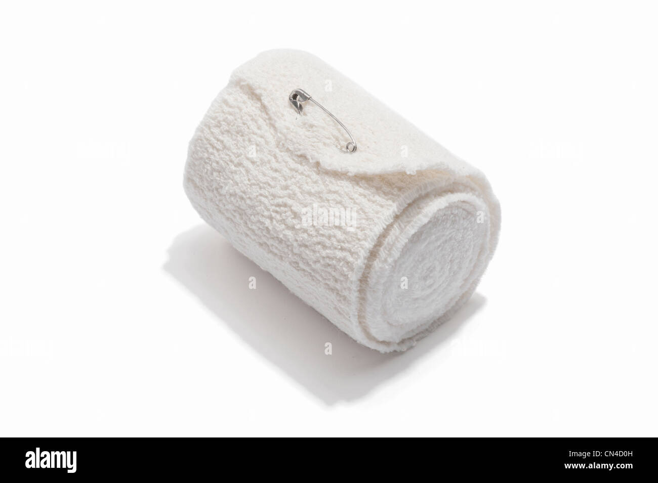 A rolled up bandage fastened with a safety pin Stock Photo - Alamy