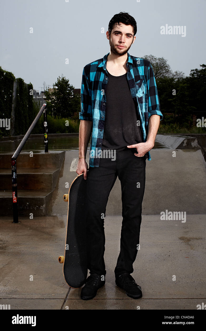 Young skateboarder in skate park, portrait Stock Photo - Alamy