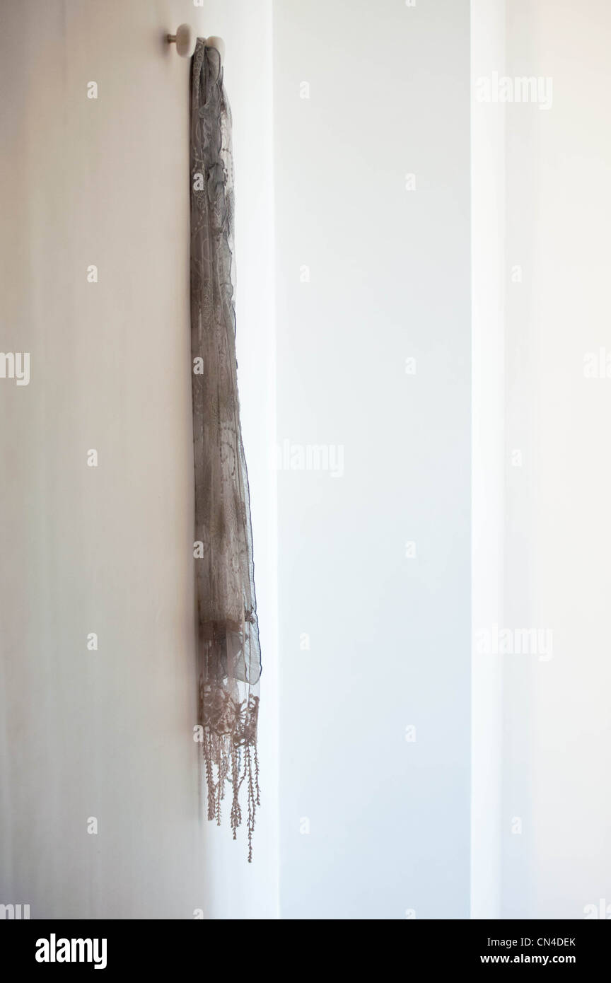 Shawl hanging from a hook Stock Photo - Alamy