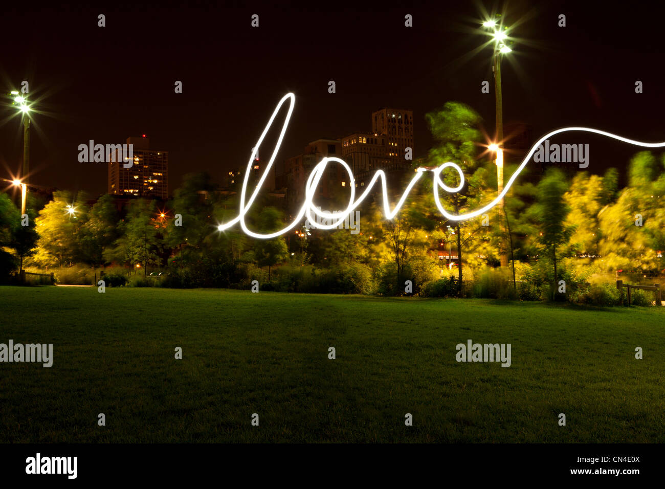 Love written by light trail at night Stock Photo - Alamy