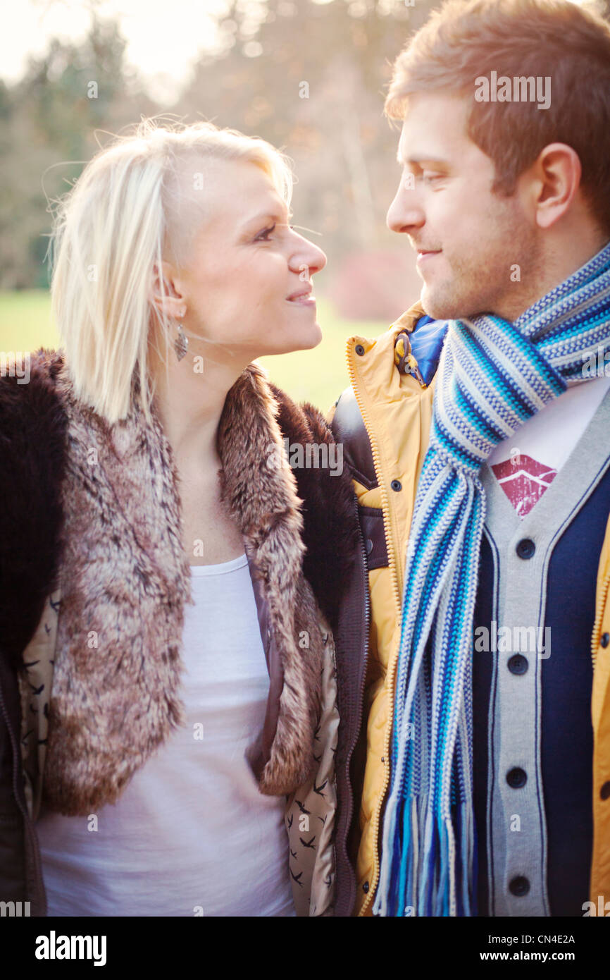 Loving couple gazing into each other's eyes in a tender moment, with ...