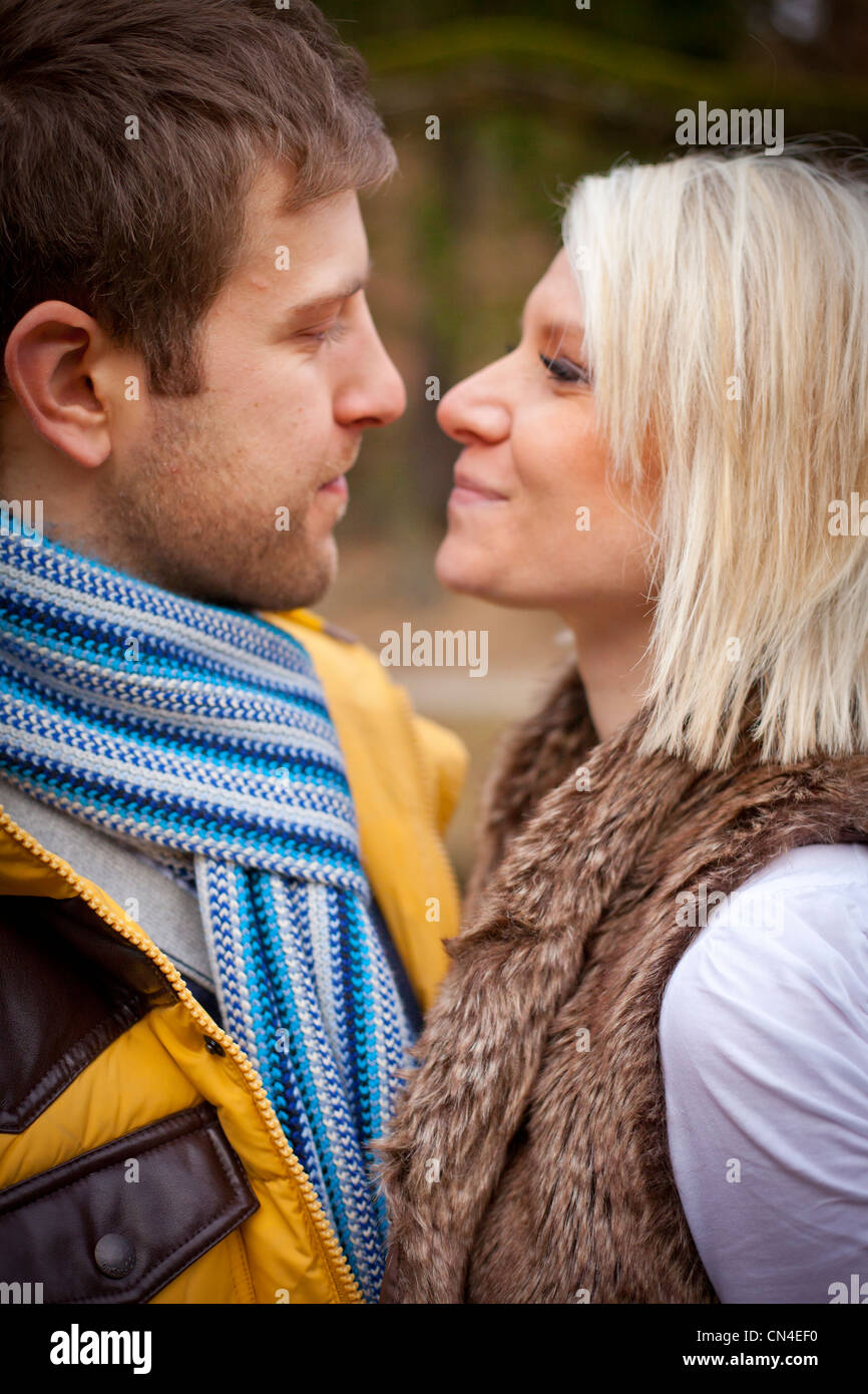 Loving couple gazing into each other's eyes in a tender moment, with ...