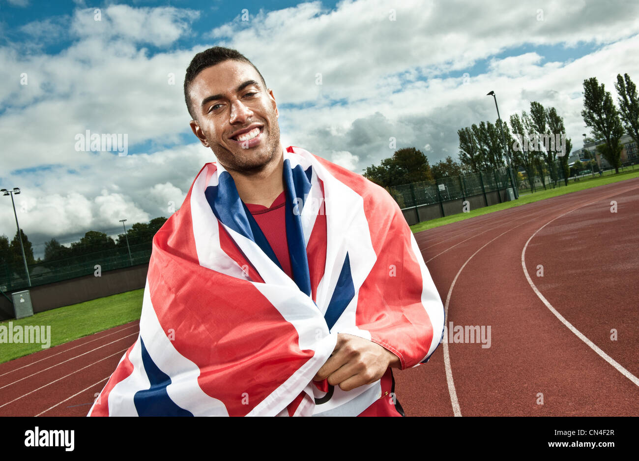 Sprinter wrapped in Union flag on sportstrack Stock Photo - Alamy