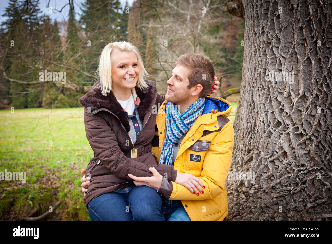 Seated by tree hi-res stock photography and images - Alamy