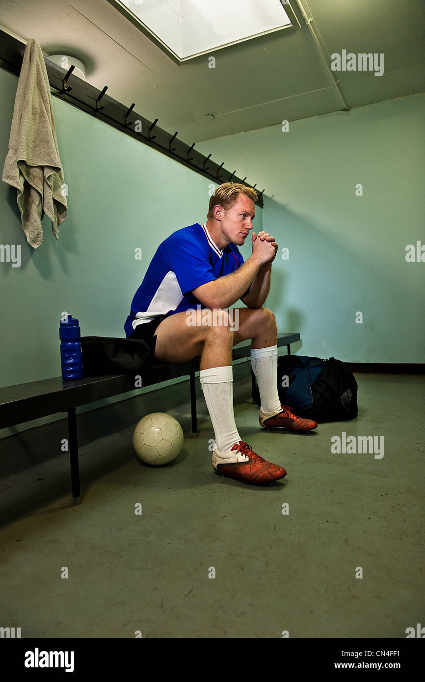 Soccer player in changing room Stock Photo - Alamy