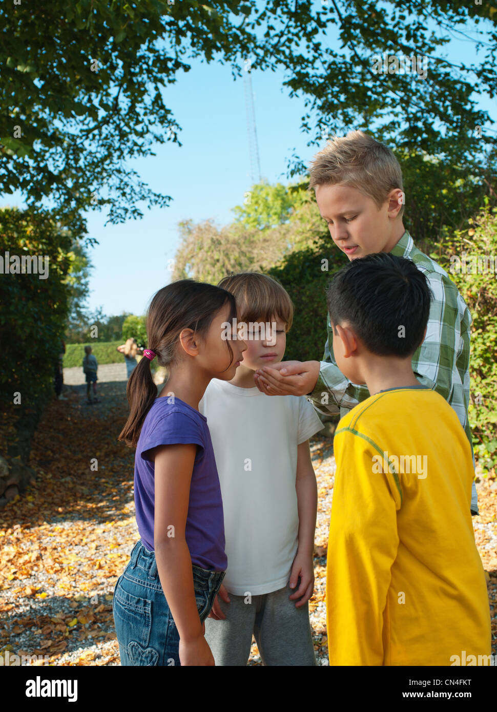 Boy showing hands to children Stock Photo - Alamy