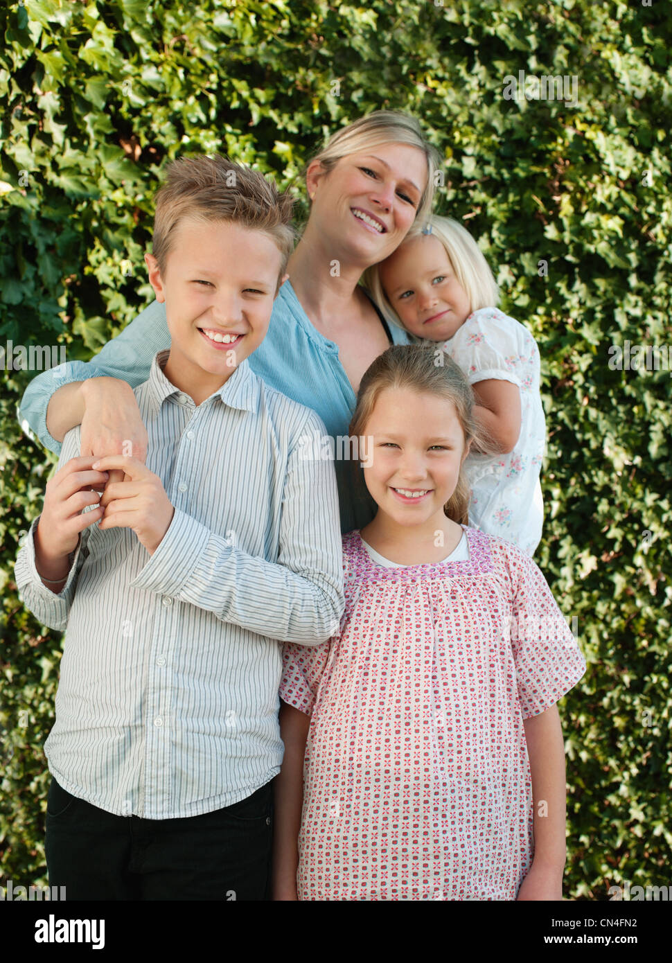 Family smiling together, portrait Stock Photo - Alamy