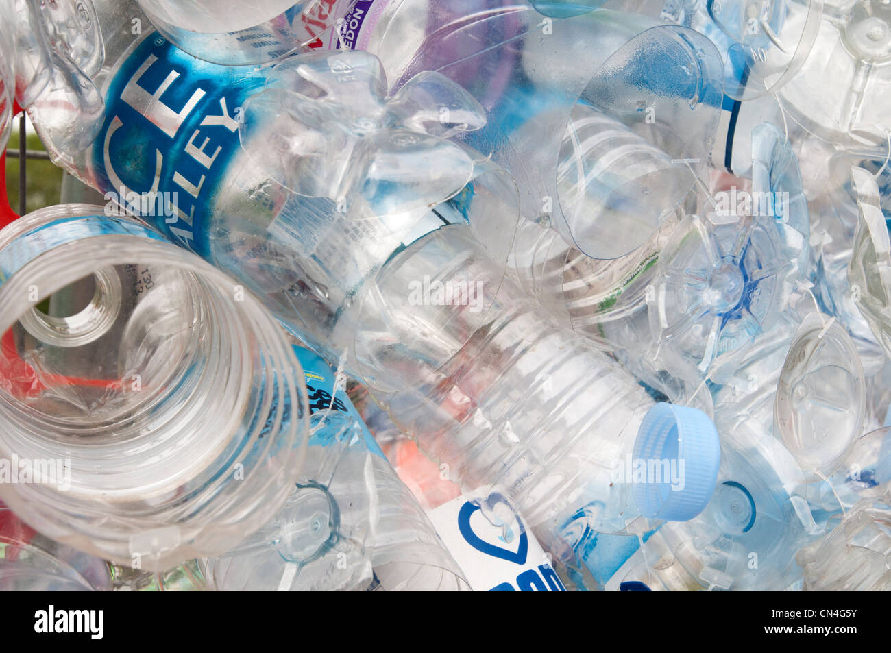 Discarded plastic bottles attached to a wire mesh fence highlight the ...