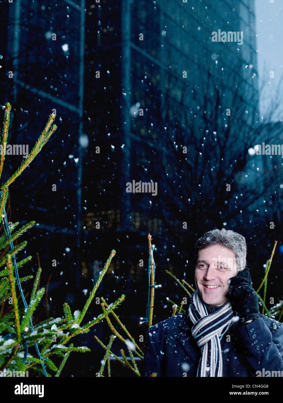Man on mobile phone in the snow Stock Photo - Alamy