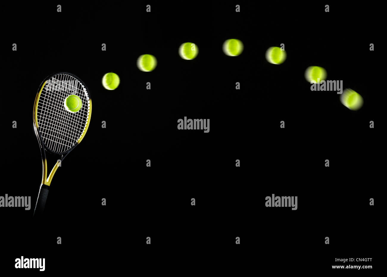 Tennis racket and balls in motion Stock Photo - Alamy