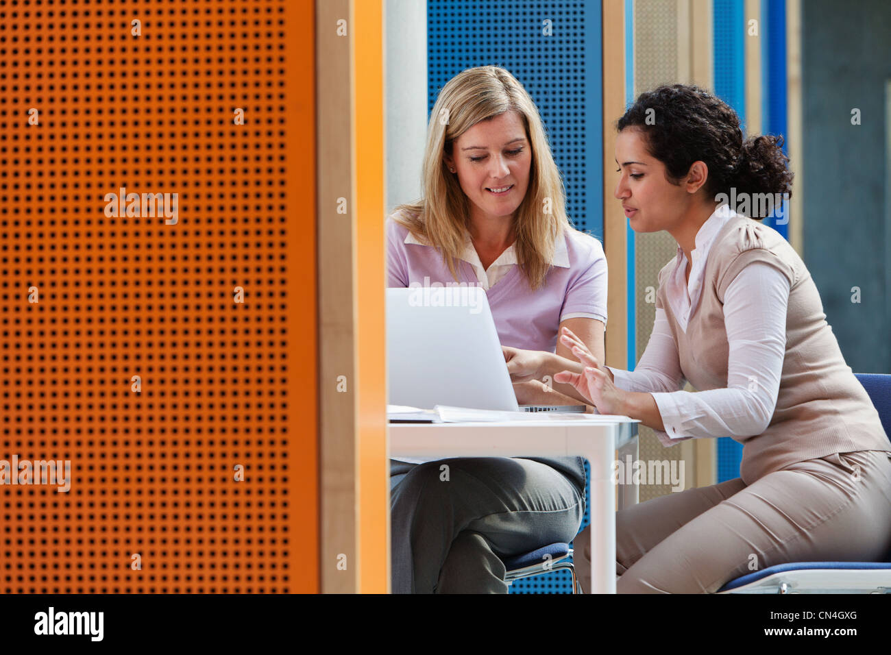 Office workers working on laptop Stock Photo - Alamy
