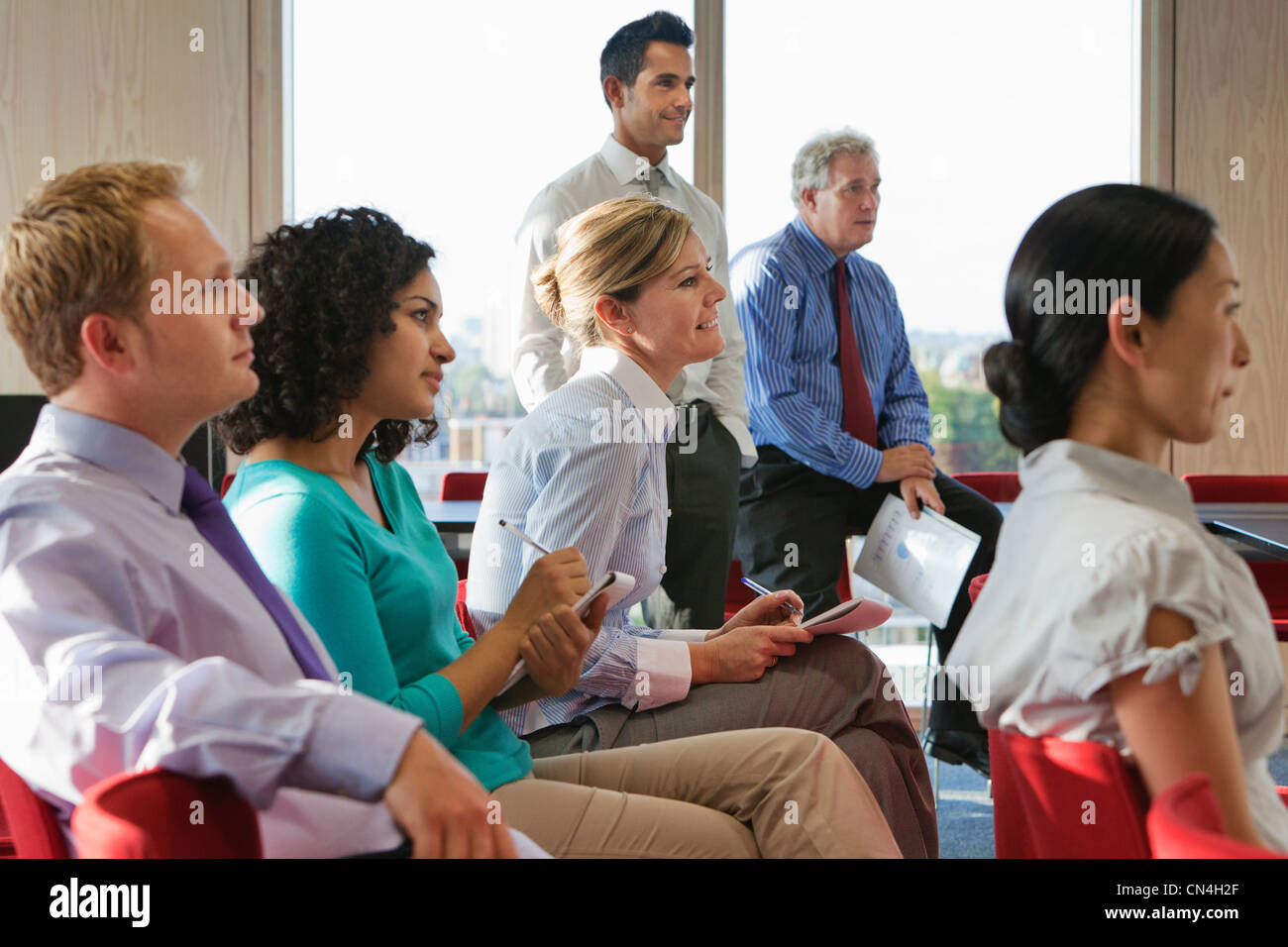 Mature hispanic woman taking notes hi-res stock photography and images ...