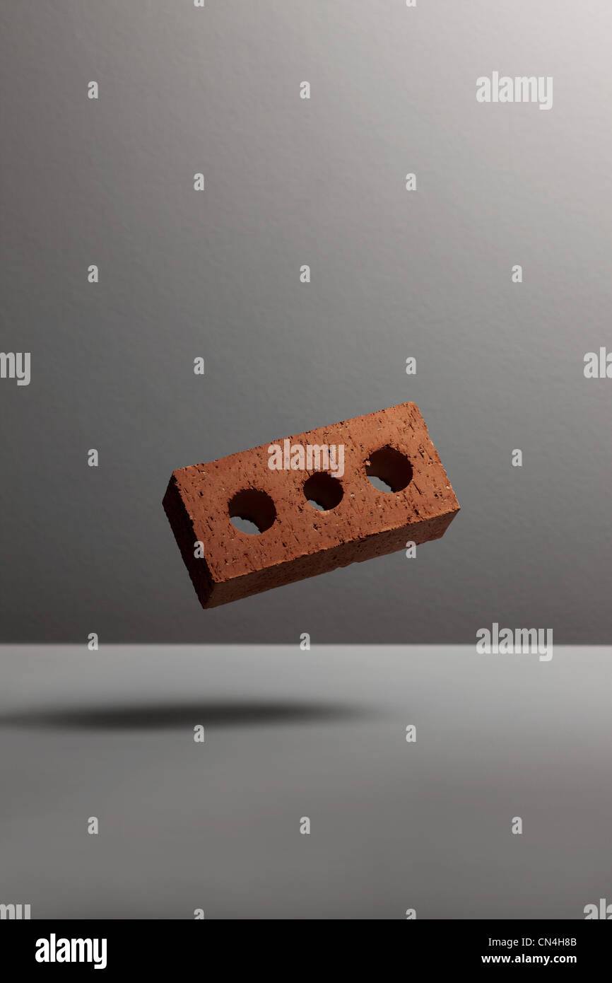 Brick suspended in mid air Stock Photo - Alamy