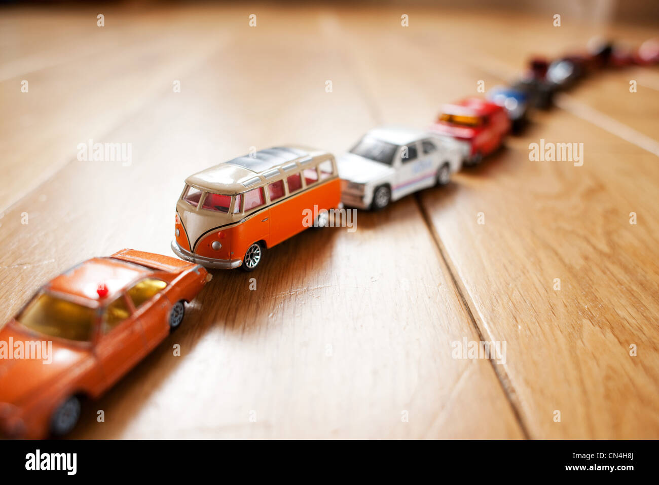 Queue of toy cars Stock Photo - Alamy