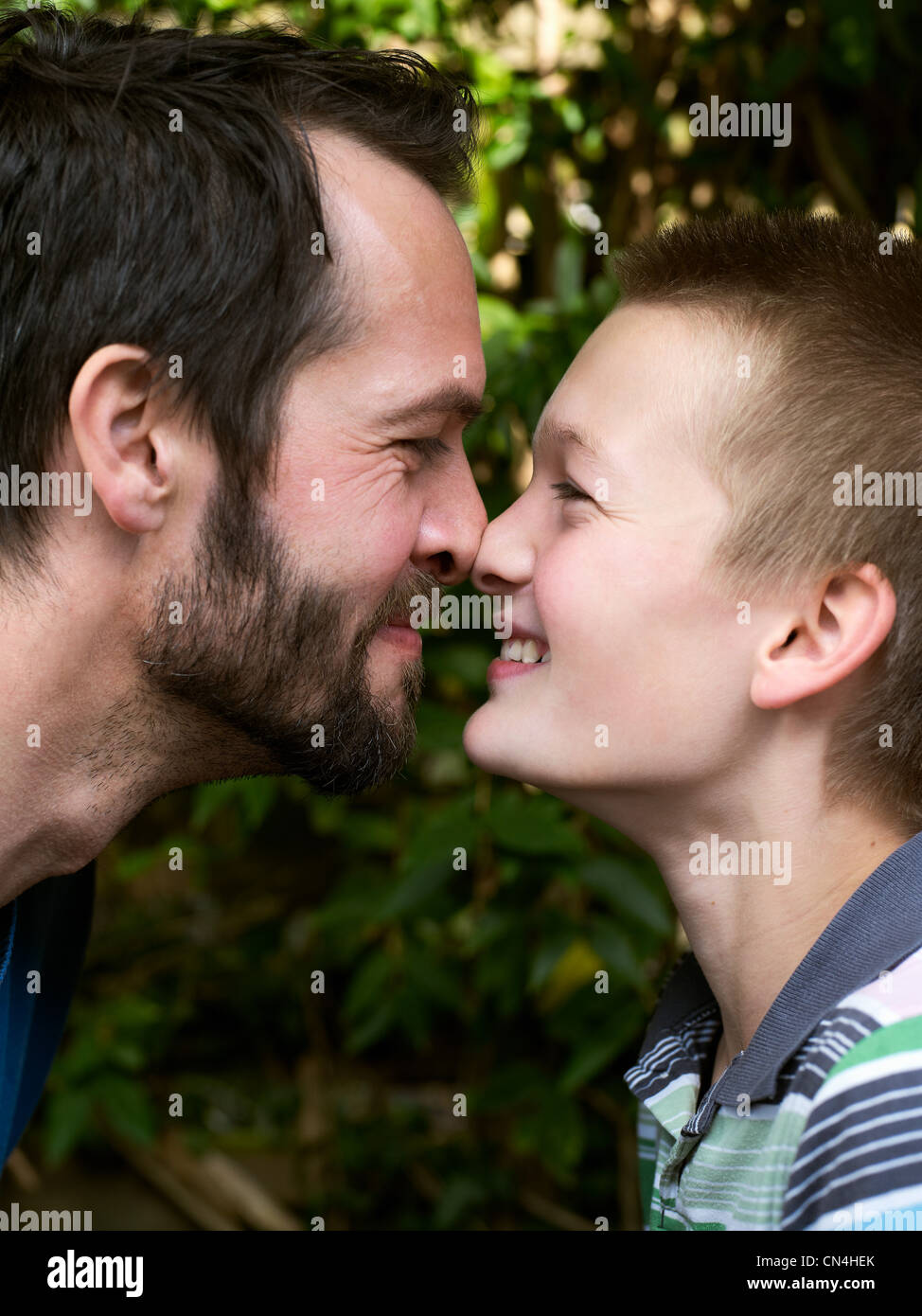 Father and son rubbing noses Stock Photo - Alamy