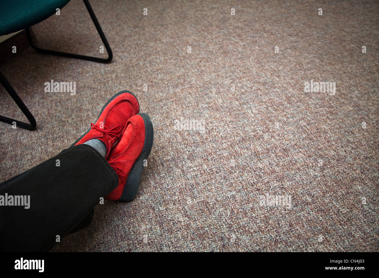Red shoes in waiting room Stock Photo - Alamy