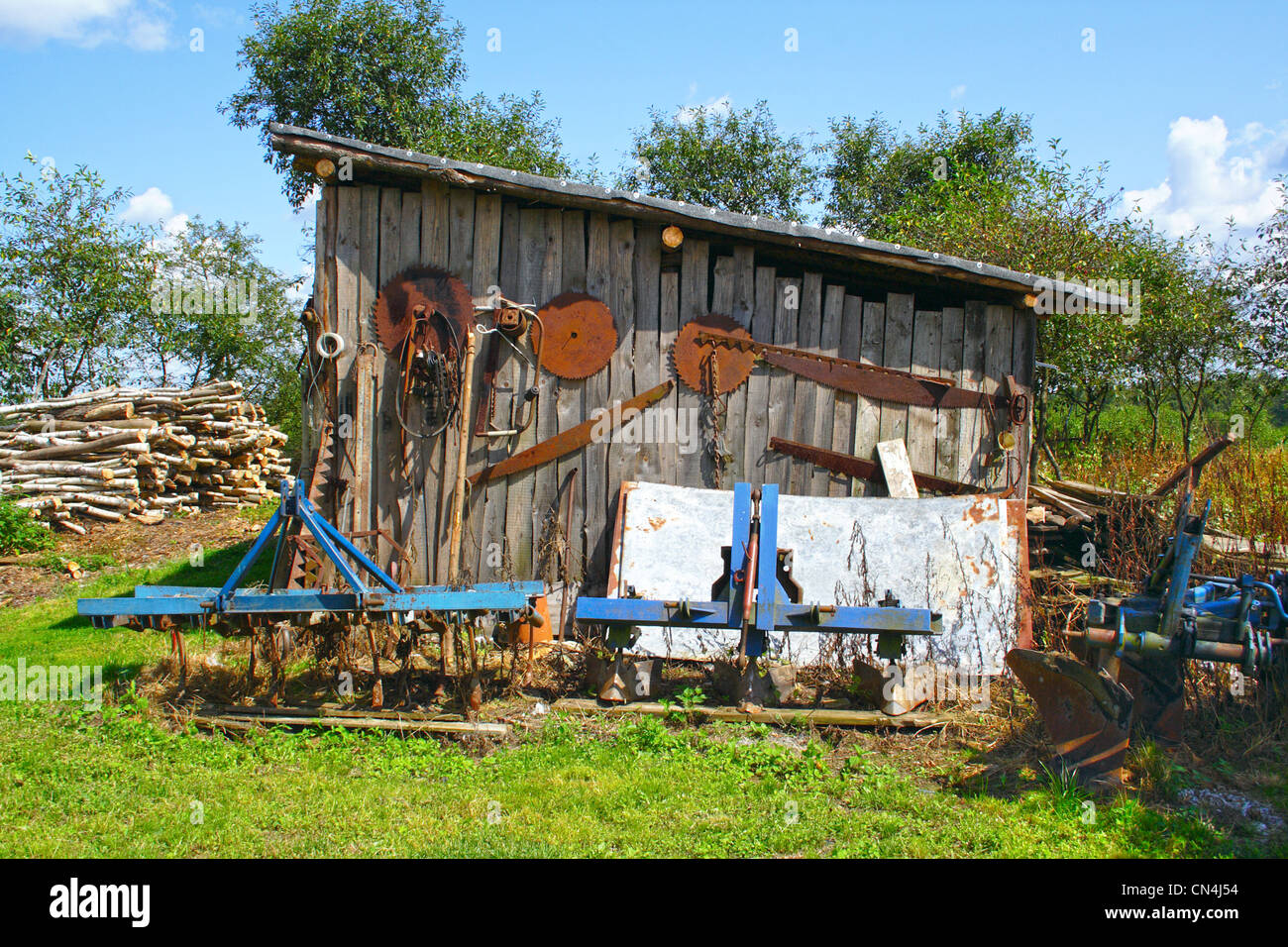 the tools hang on her wooden shed Stock Photo - Alamy