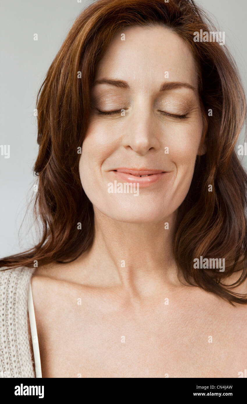 Happy and relaxed woman with closed eyes Stock Photo - Alamy