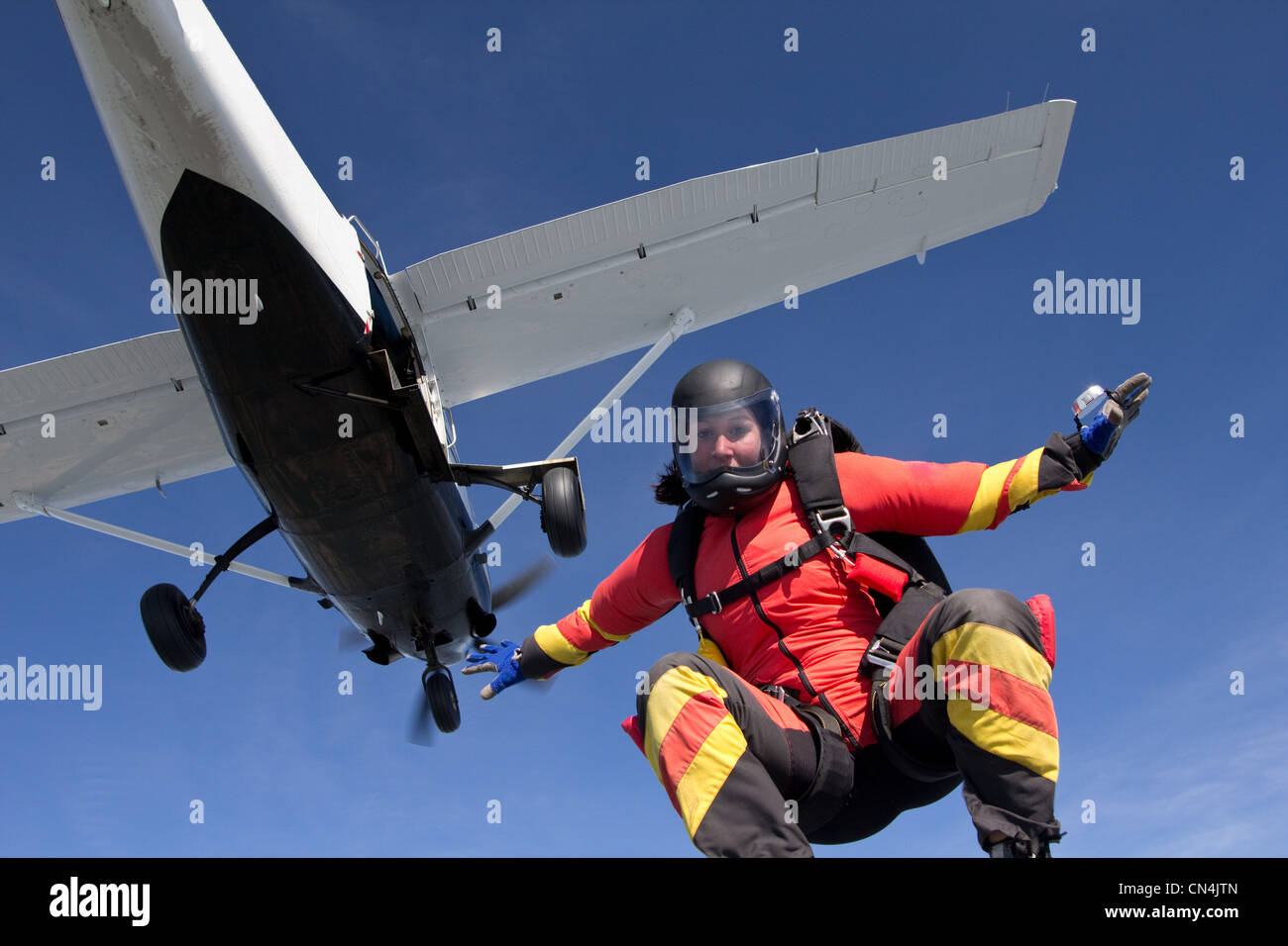Woman jumping from plane hi-res stock photography and images - Alamy