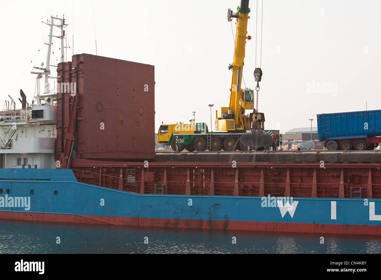 Bulk cargo ship discharging at port of Fraserburgh Scotland UK Stock ...